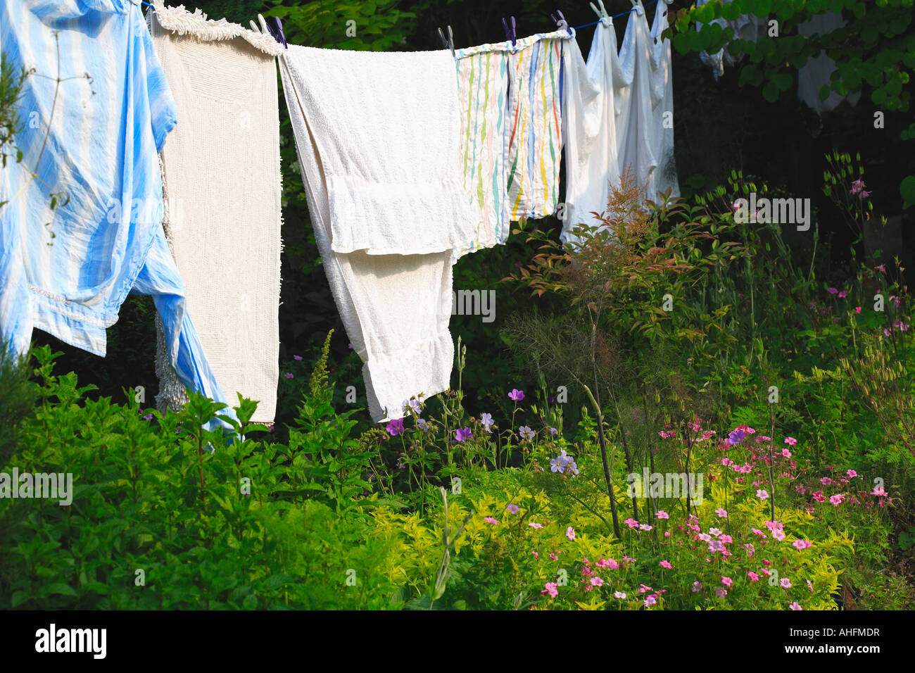 Washing on the line in country garden Stock Photo - Alamy