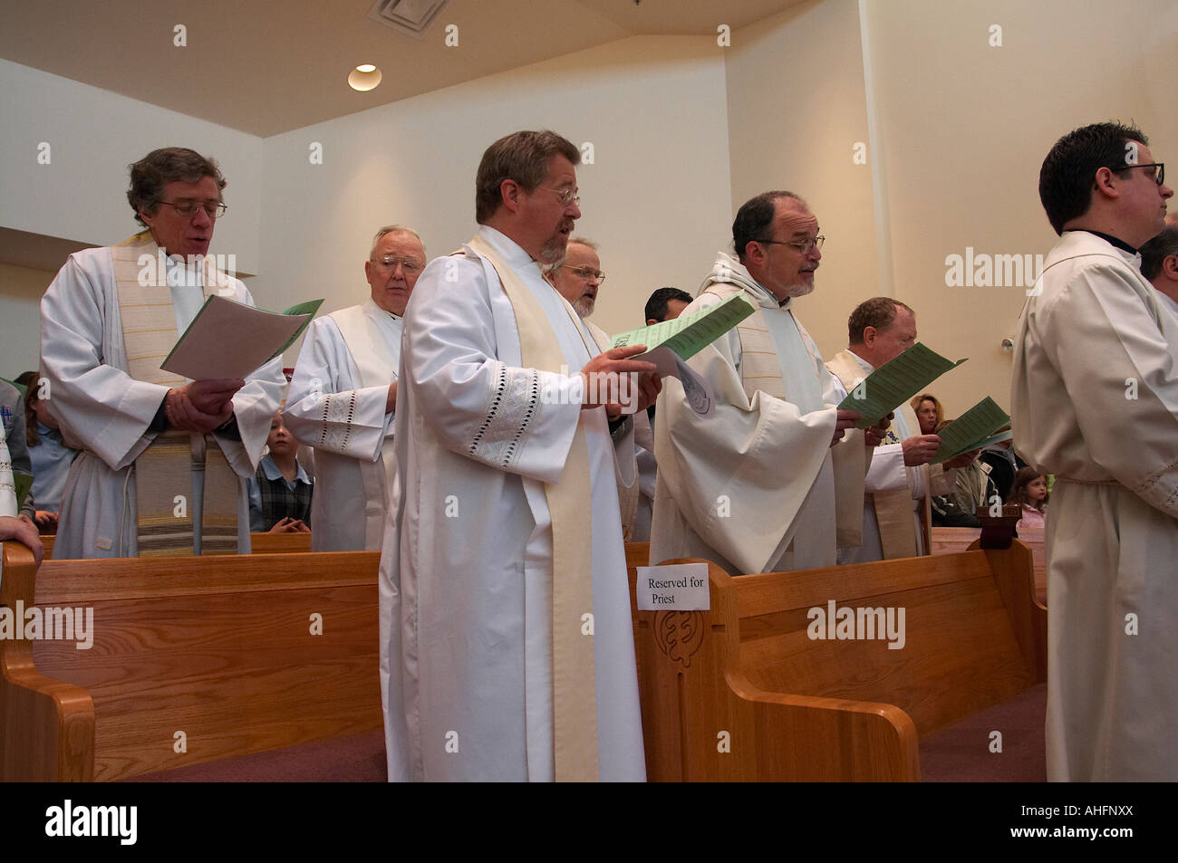 Catholic priests singing hymns during Mass Stock Photo - Alamy Catholic priests singing hymns during Mass Stock Photo - Alamy