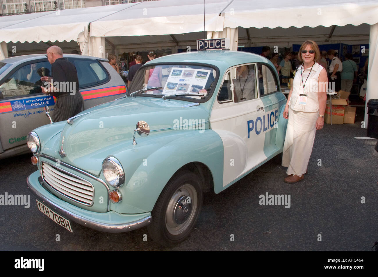 Tourist poses by vintage Morris Minor police car Stock Photo - Alamy