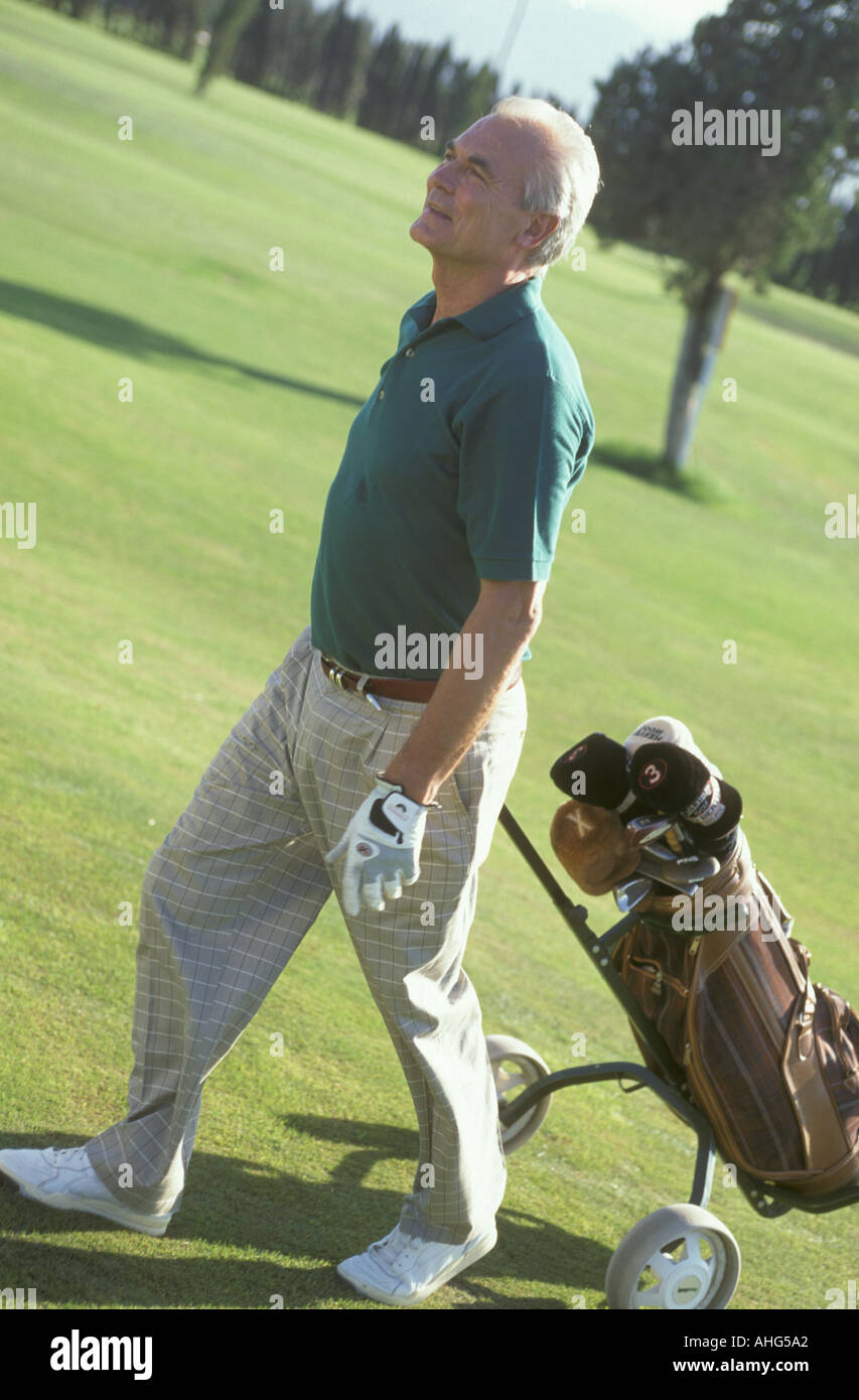 mature man playing golf Stock Photo - Alamy
