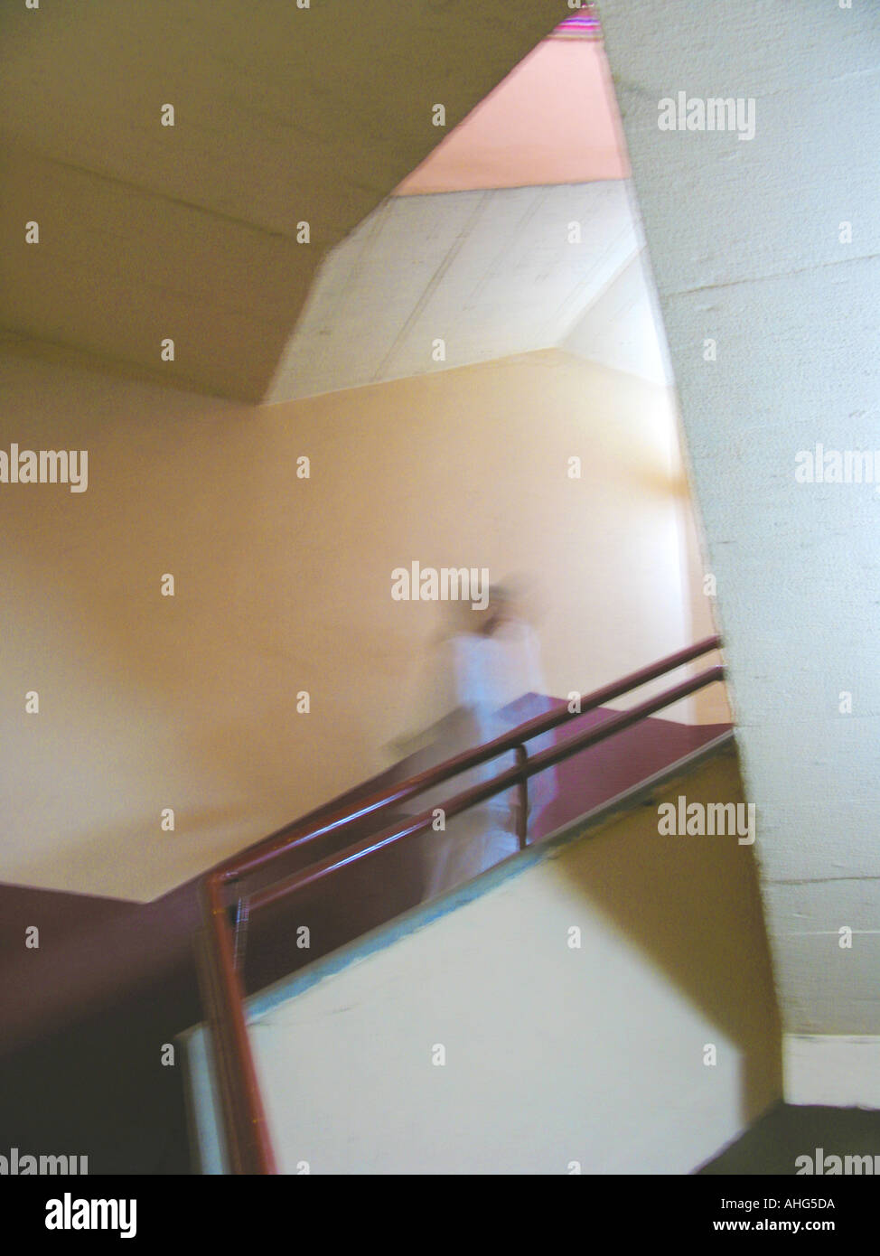 Blurred figure on stairs Stock Photo - Alamy