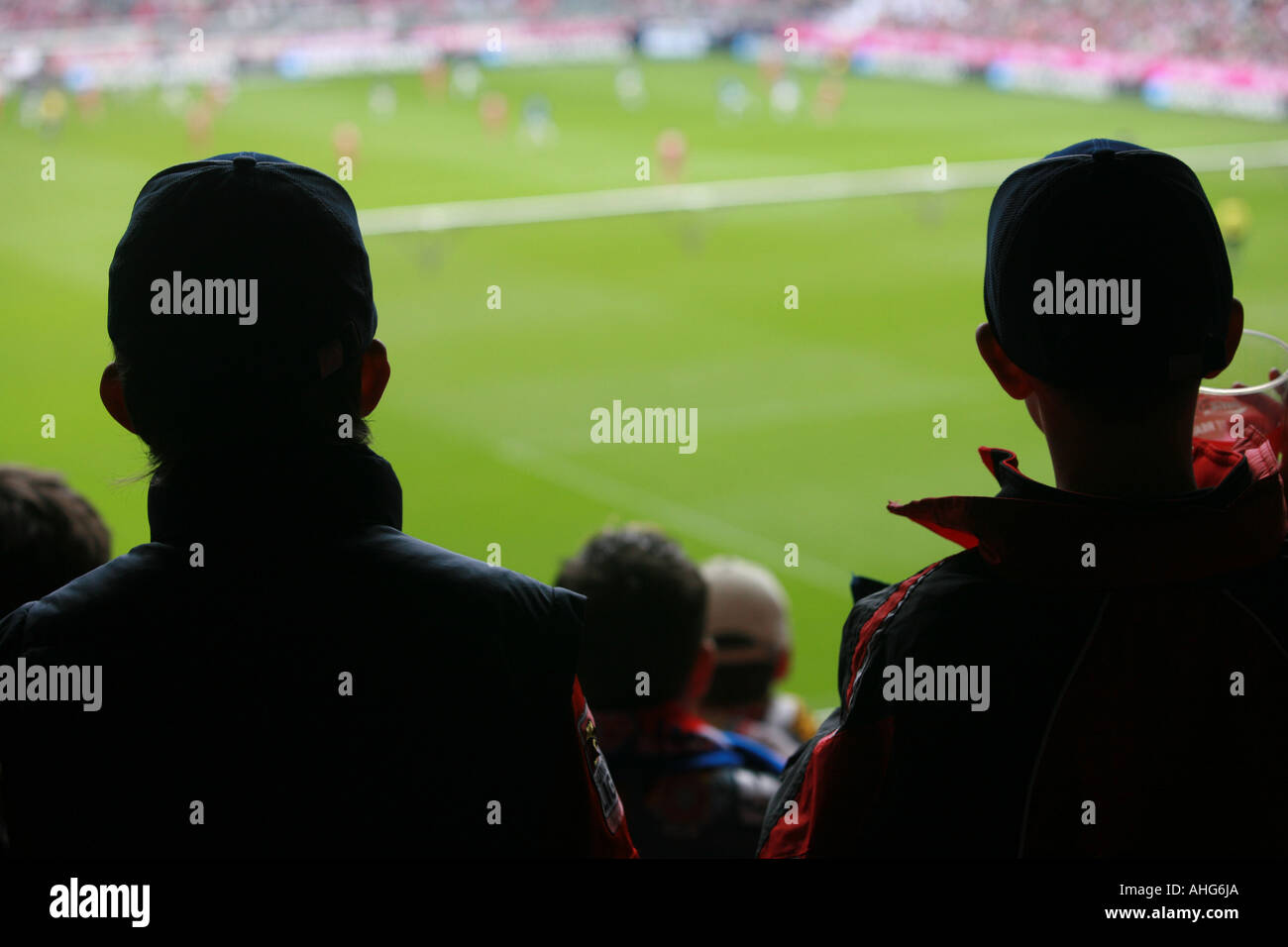 people watching a sports game in a stadion Stock Photo - Alamy