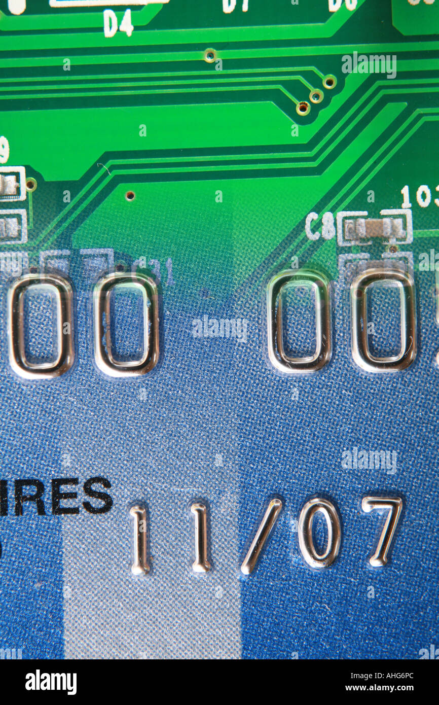 a credit card is blending over in a electronic circuit as a symbol for ...