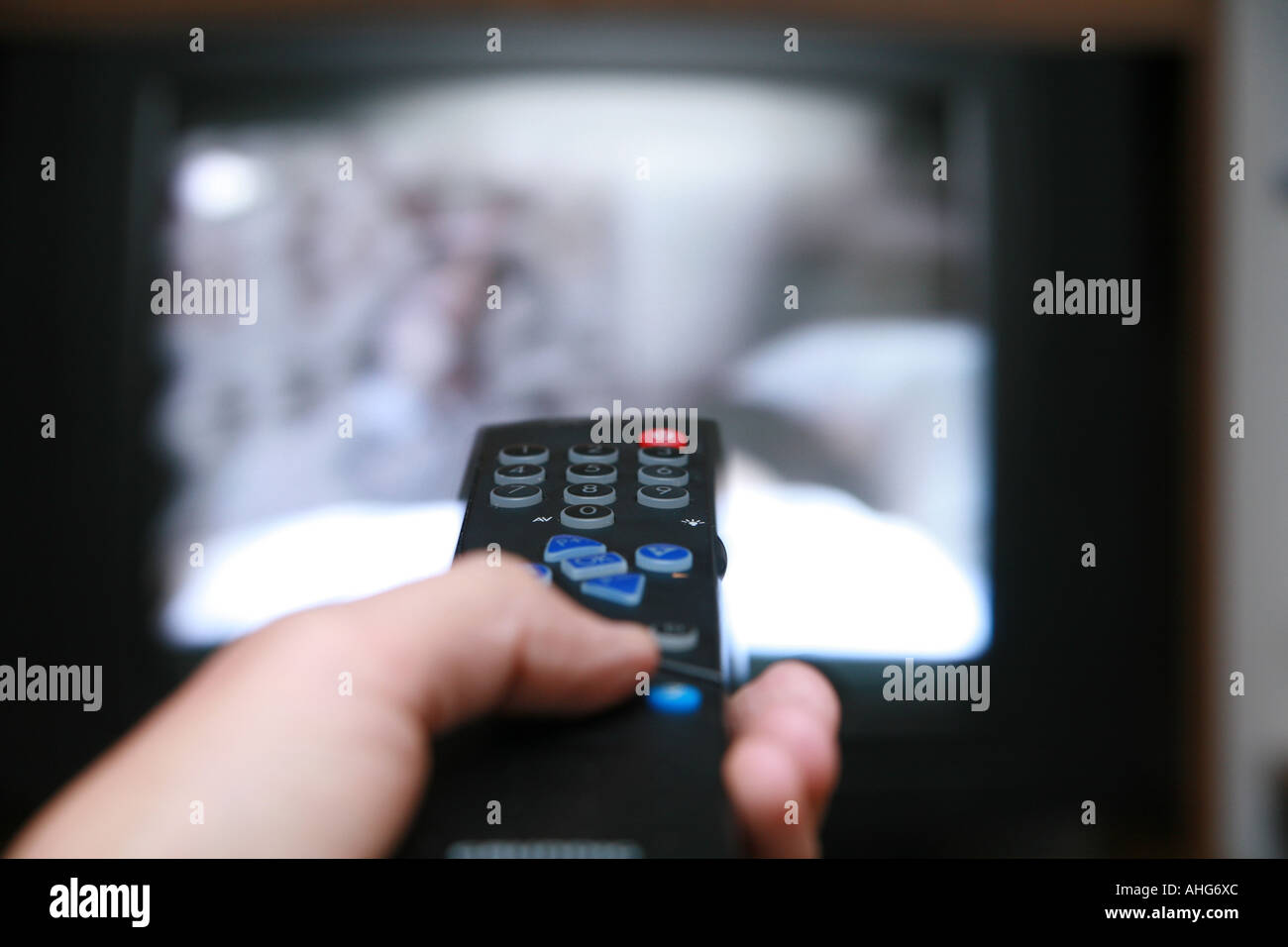 a remote control pointing to a tv Stock Photo - Alamy