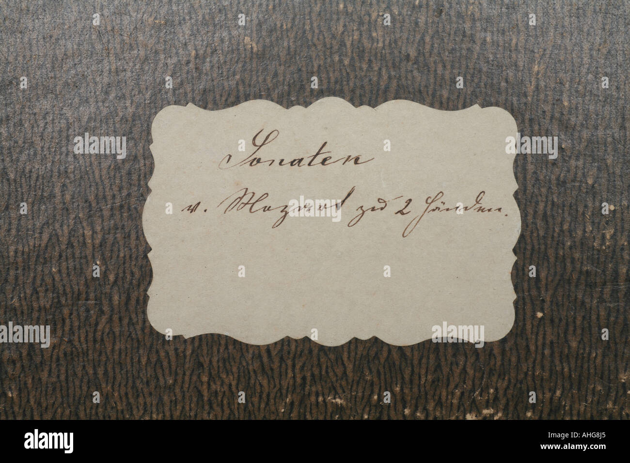 close up of an ancient song book cover detail Stock Photo - Alamy