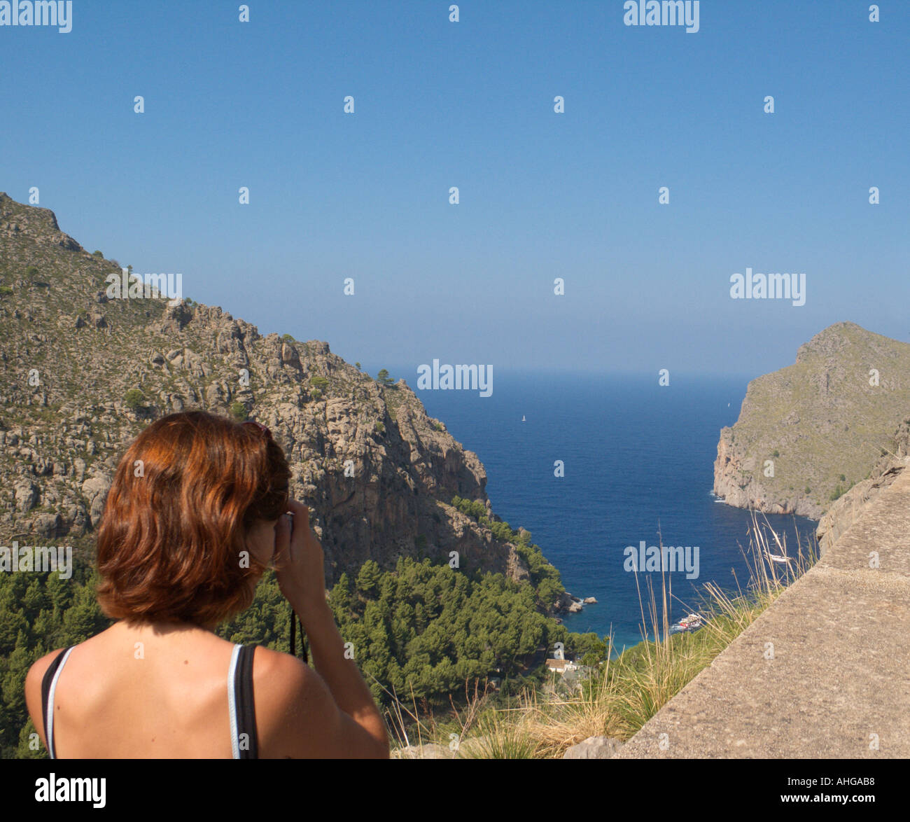 Tourist overlooking Sa Colabra Bay Majorca Spain Stock Photo - Alamy