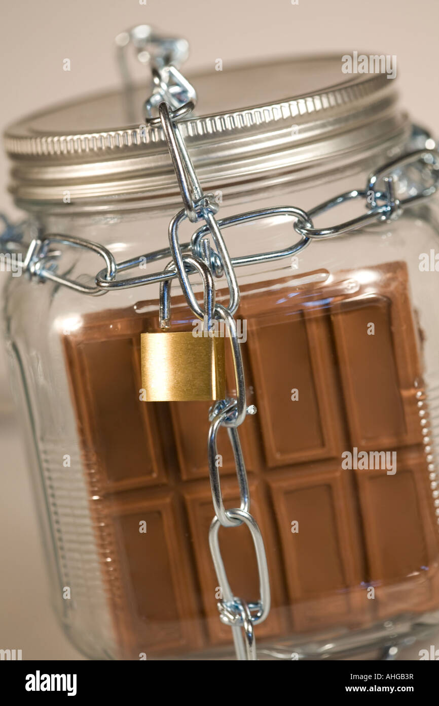 Chocolate bars locked in a jar Stock Photo - Alamy