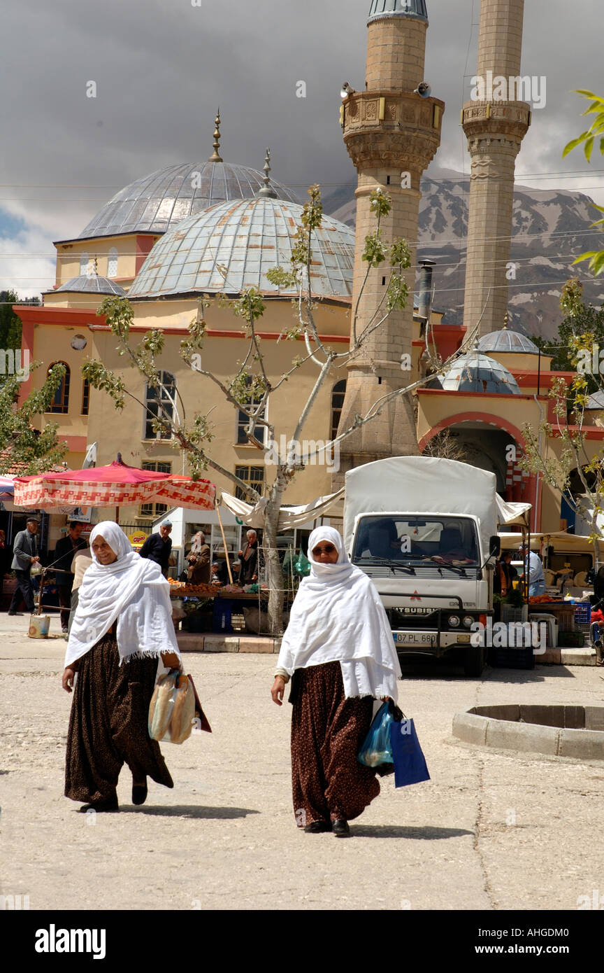 Two veiled women in front of Mosque in Gombe, Anatolya Turkey Stock ...