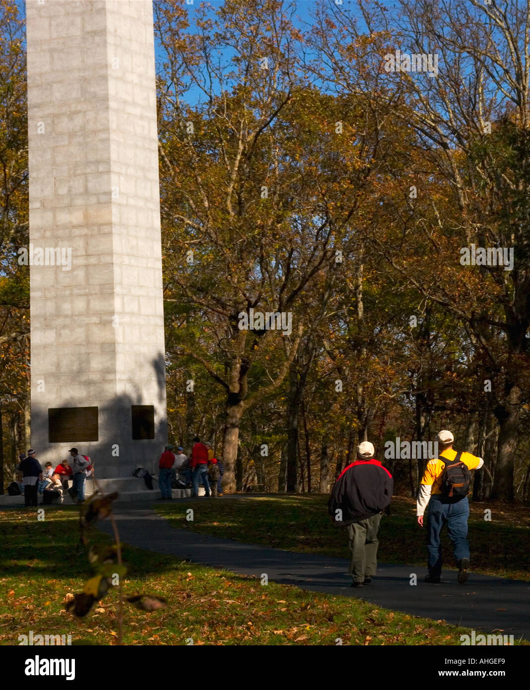 Hikers with backpacks walking toward historic monument at Kings ...