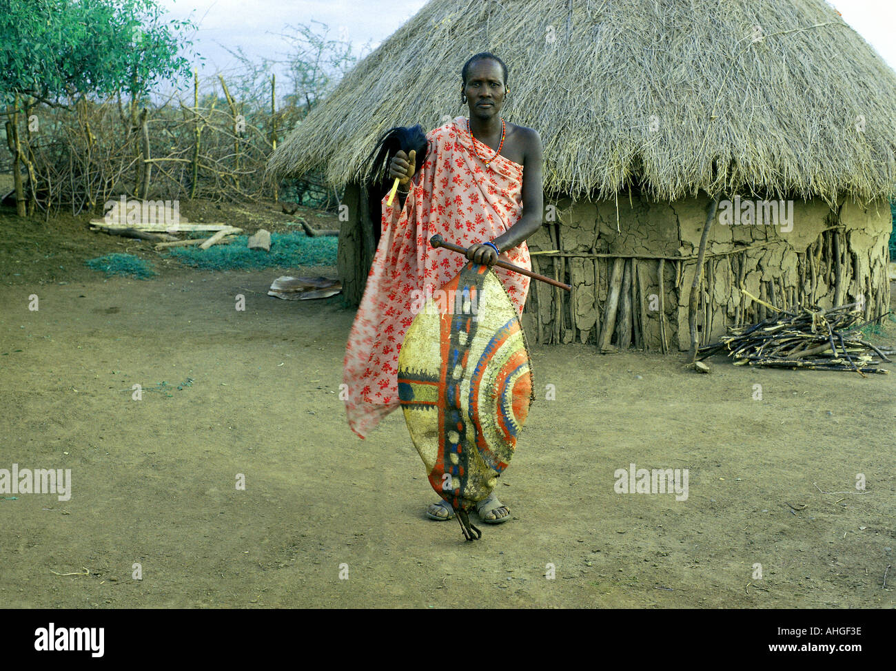 Njemps elder in traditional dress outside his hut near Lake Baringo in ...
