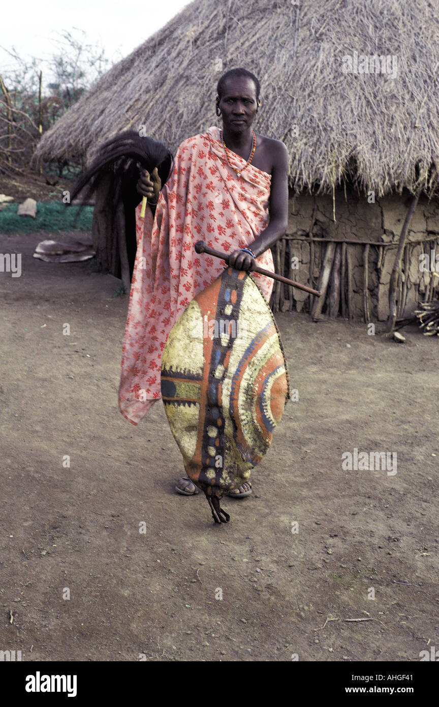 Njemps elder in traditional dress outside his hut near Lake Baringo in ...