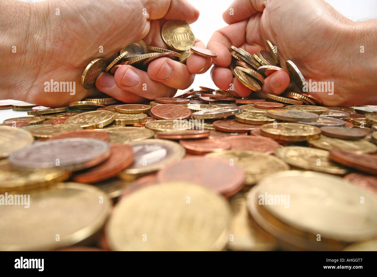 grabbing all the money hands grabbing coins isolated white background ...