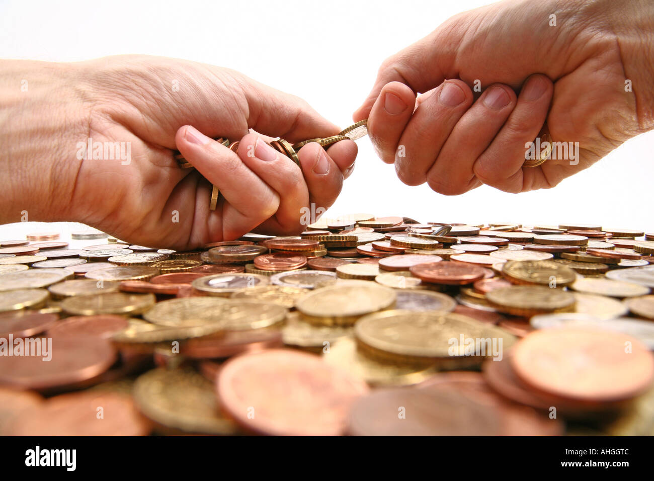 grabbing all the money hands grabbing coins isolated white background ...