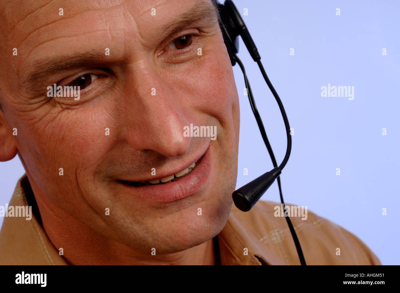 Man wearing a telephone headset Stock Photo - Alamy