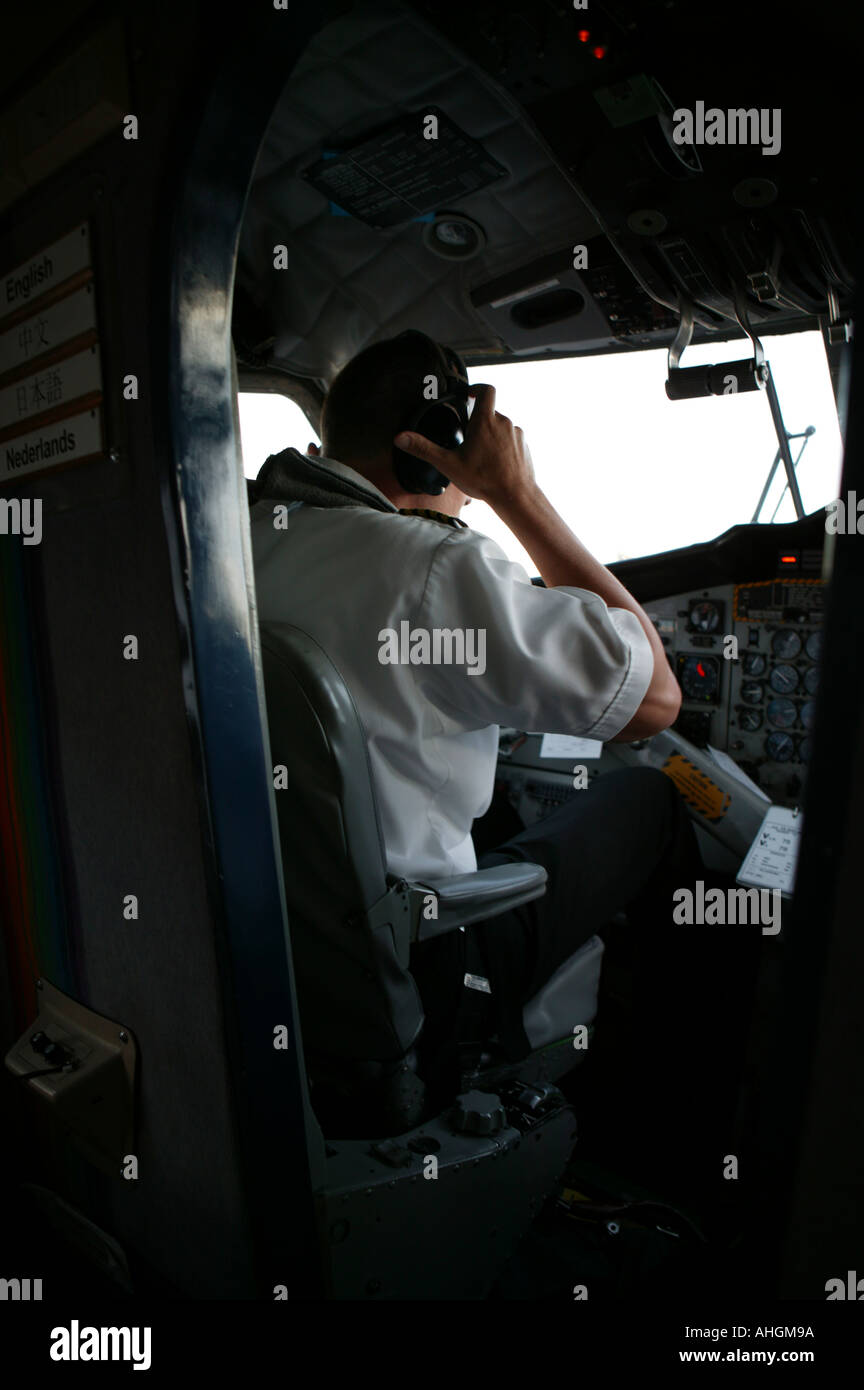 pilot in cockpit of small plane on a flight over the grand canyon from ...