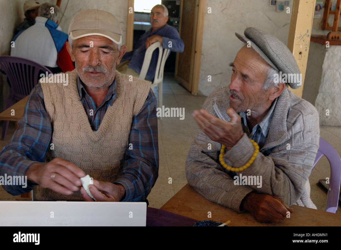 Men in village of Saribelen in Southern Turkey playing games chatting ...