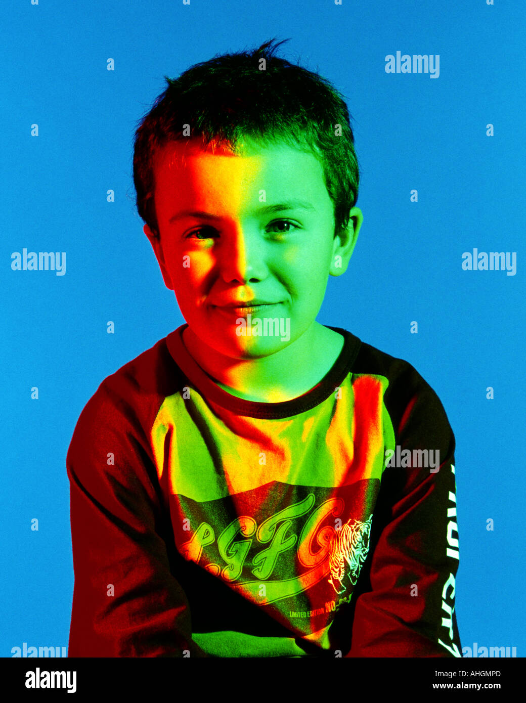 Boy looking intensely to camera lit with coloured lighting gels Stock ...