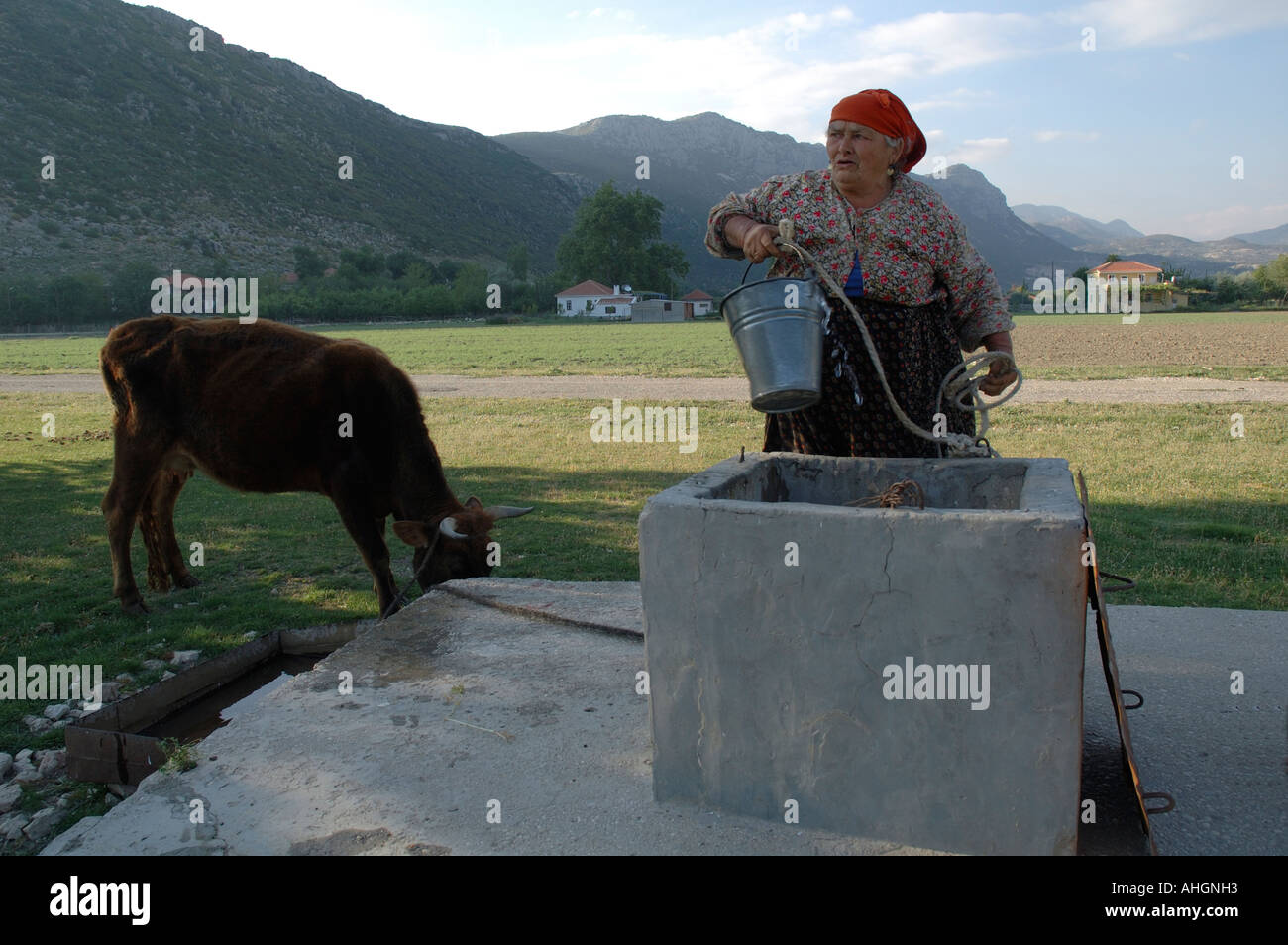 Woman in small village of Bezirgan in Southern Turkey pulling water out ...