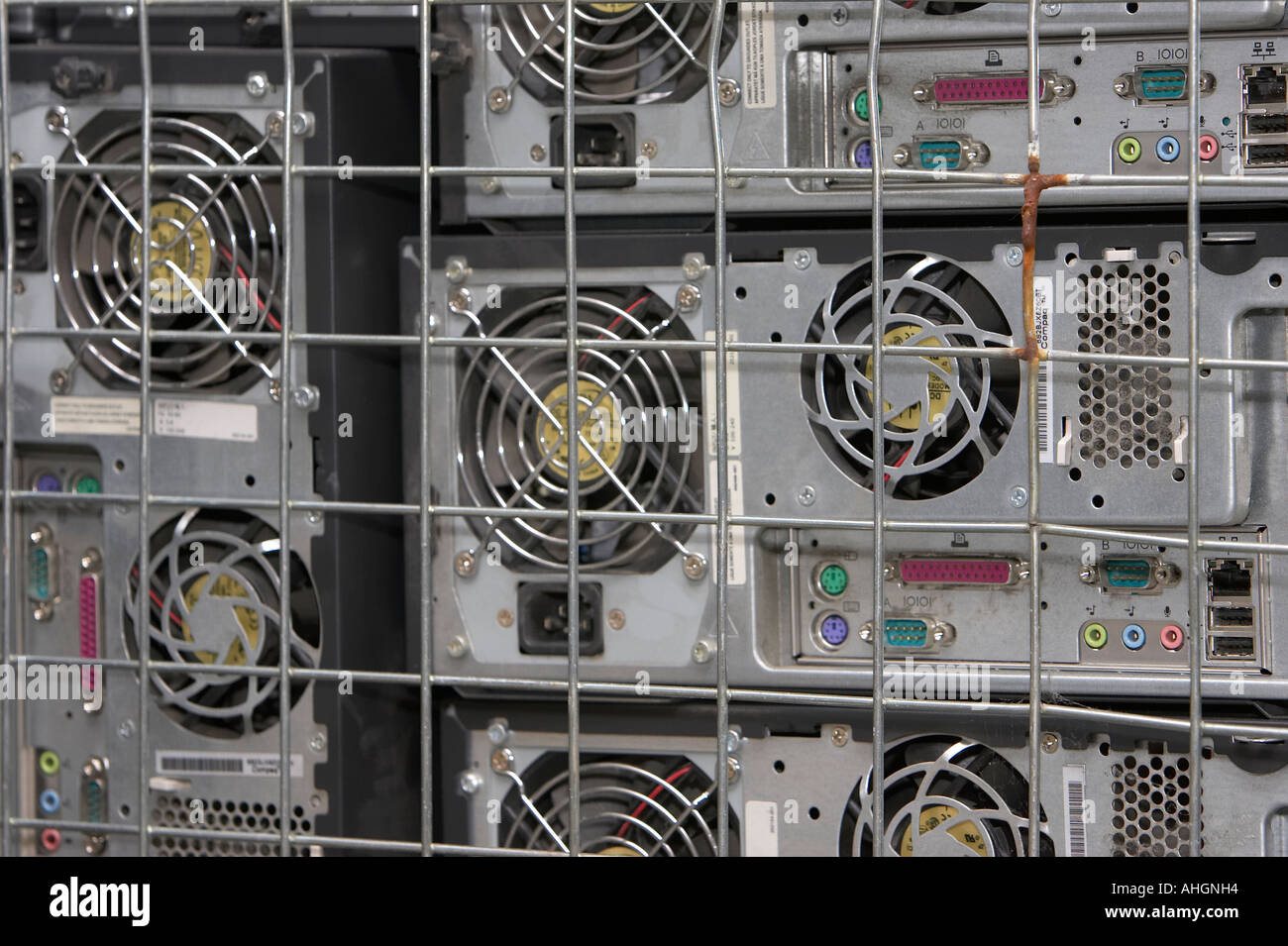 Steel cage containers containing piles of old computer system boxes ...