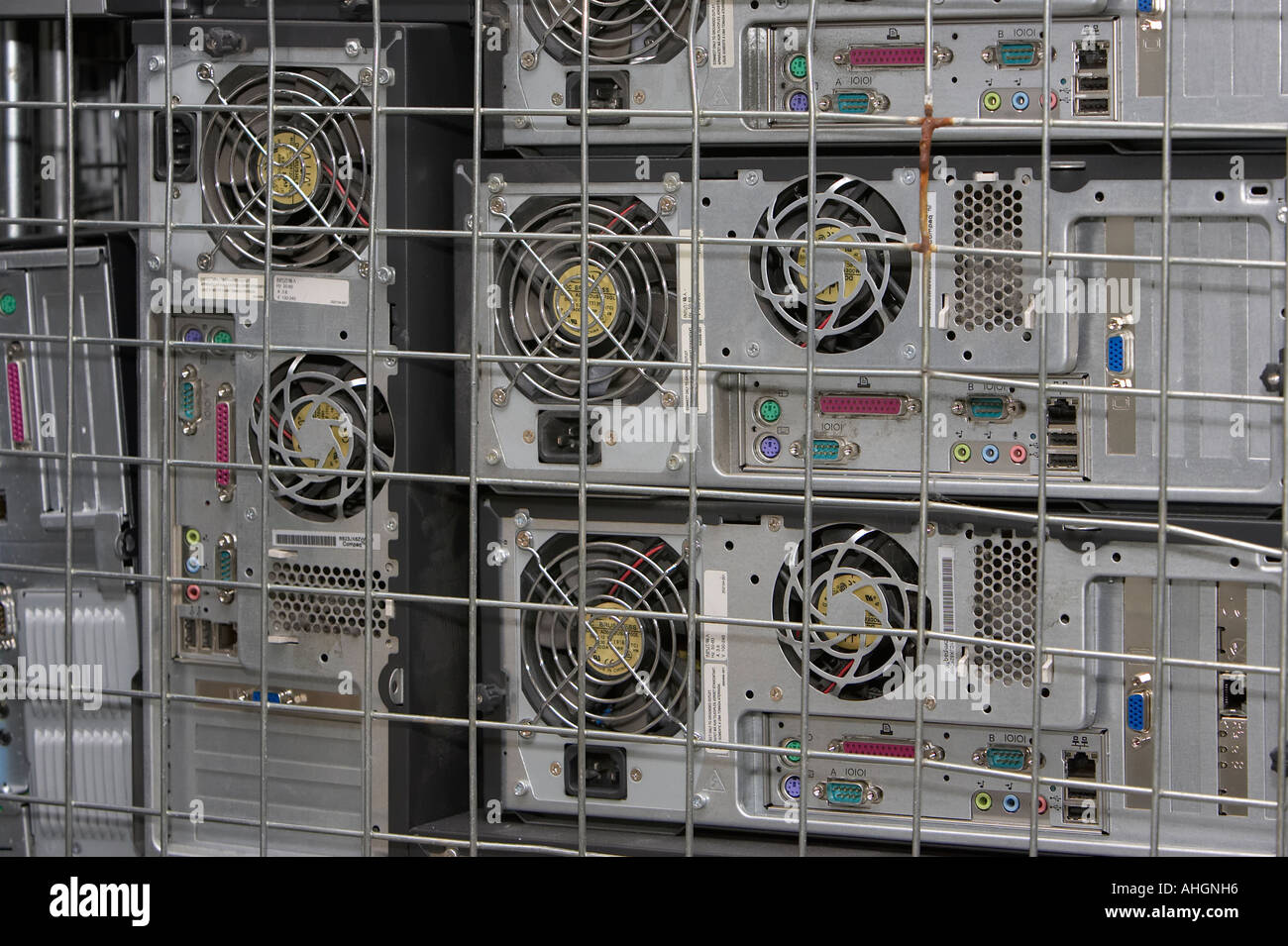 Steel cage containers containing piles of old computer system boxes ...