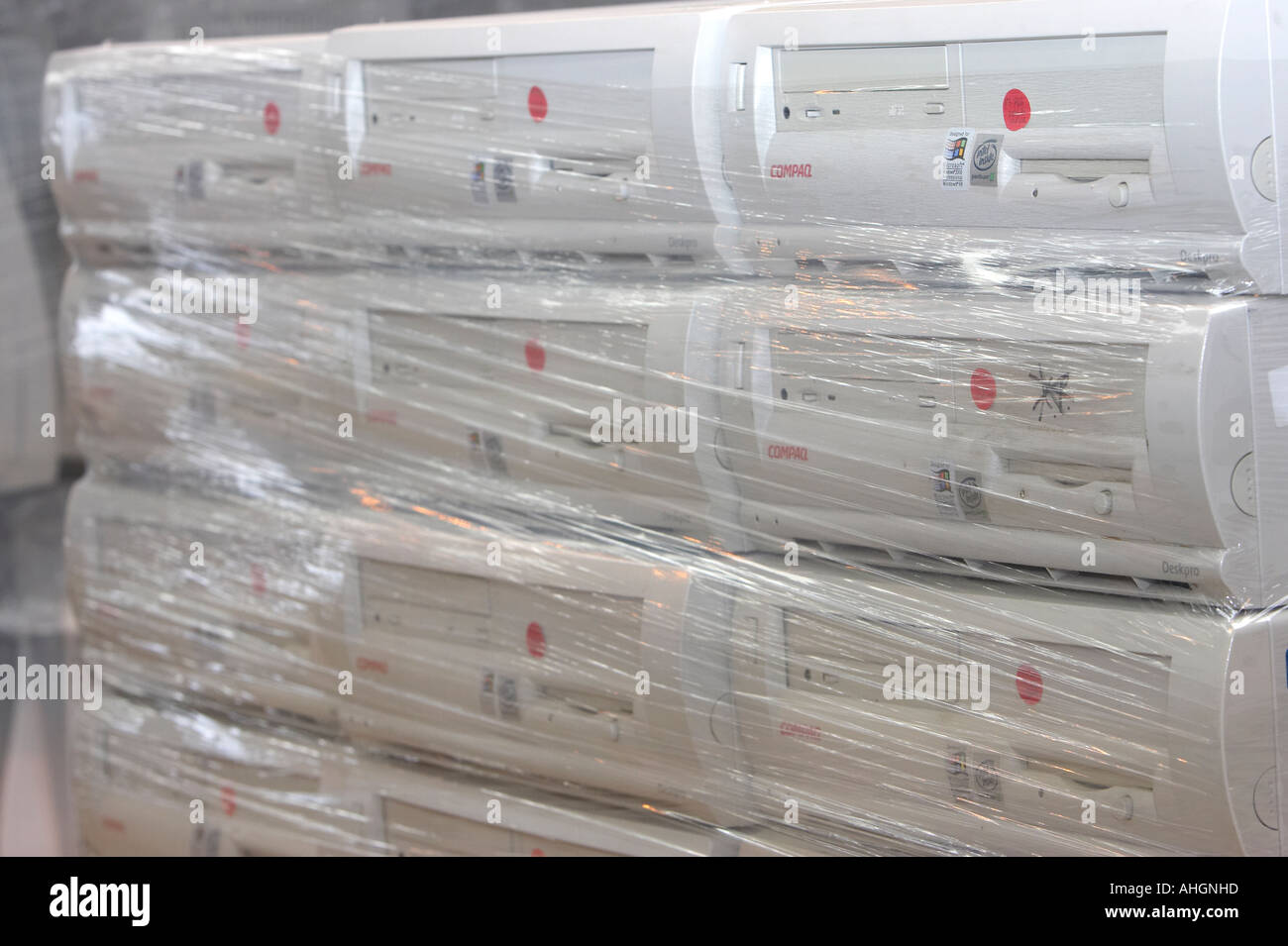 pallet wrapped pile of stacks of computer system boxes ready for data ...