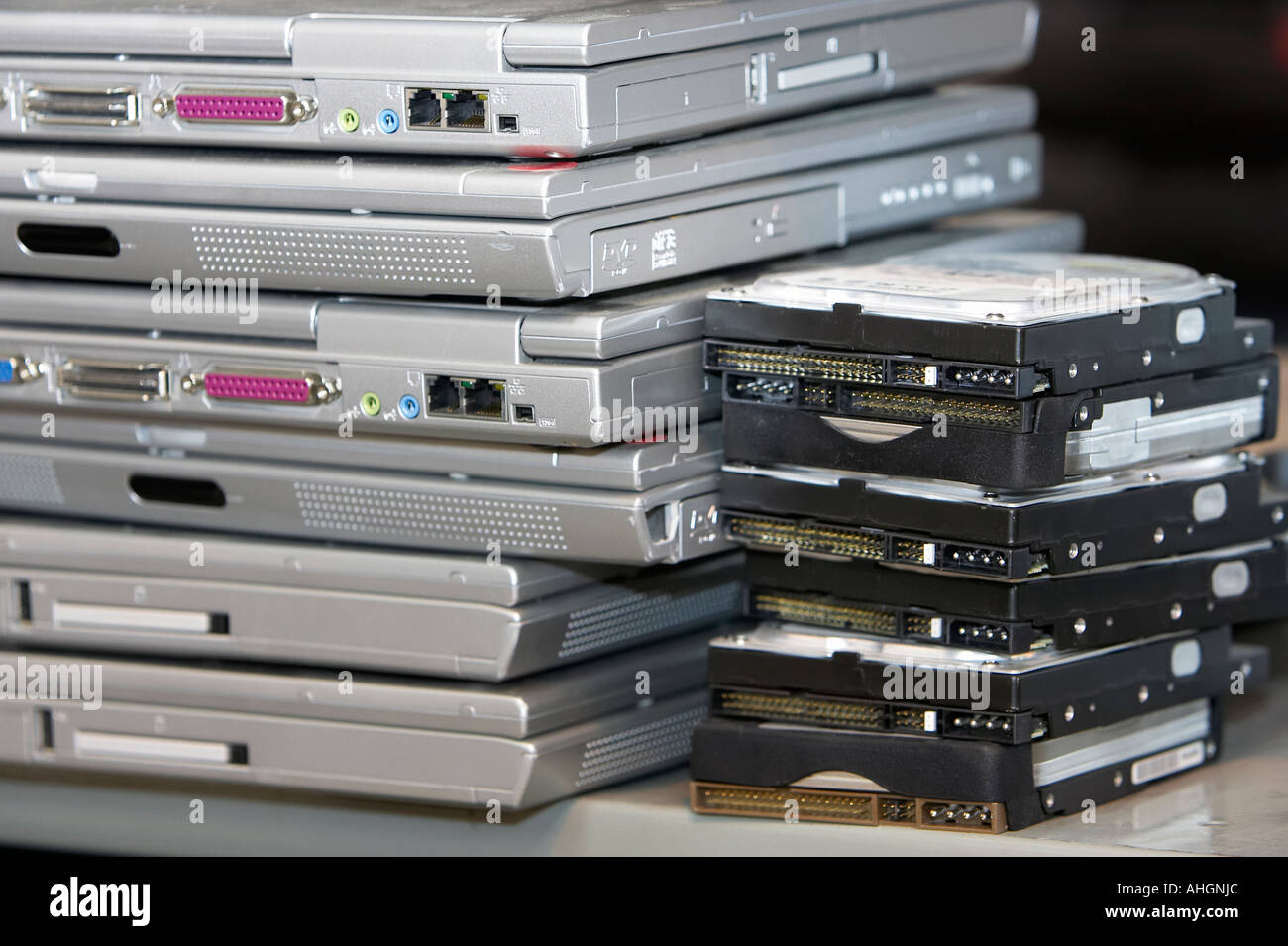 pile of laptop and laptop hard drives for data wiping and recycling ...