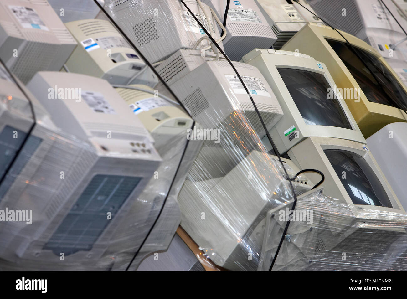 piles of pallet wrapped old discarded computer CRT monitors in ...