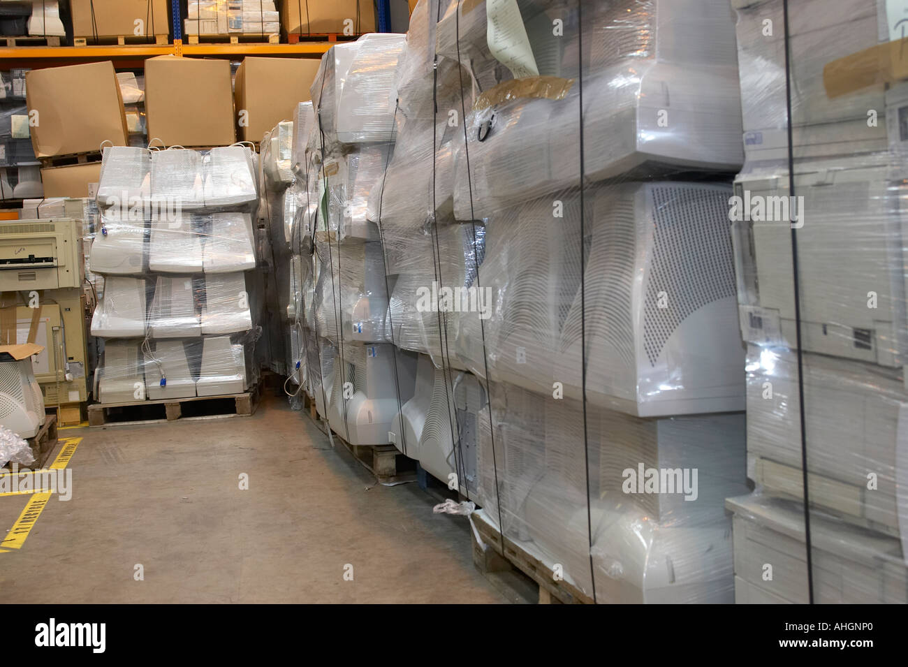 piles of pallet wrapped old discarded computer CRT monitors in ...
