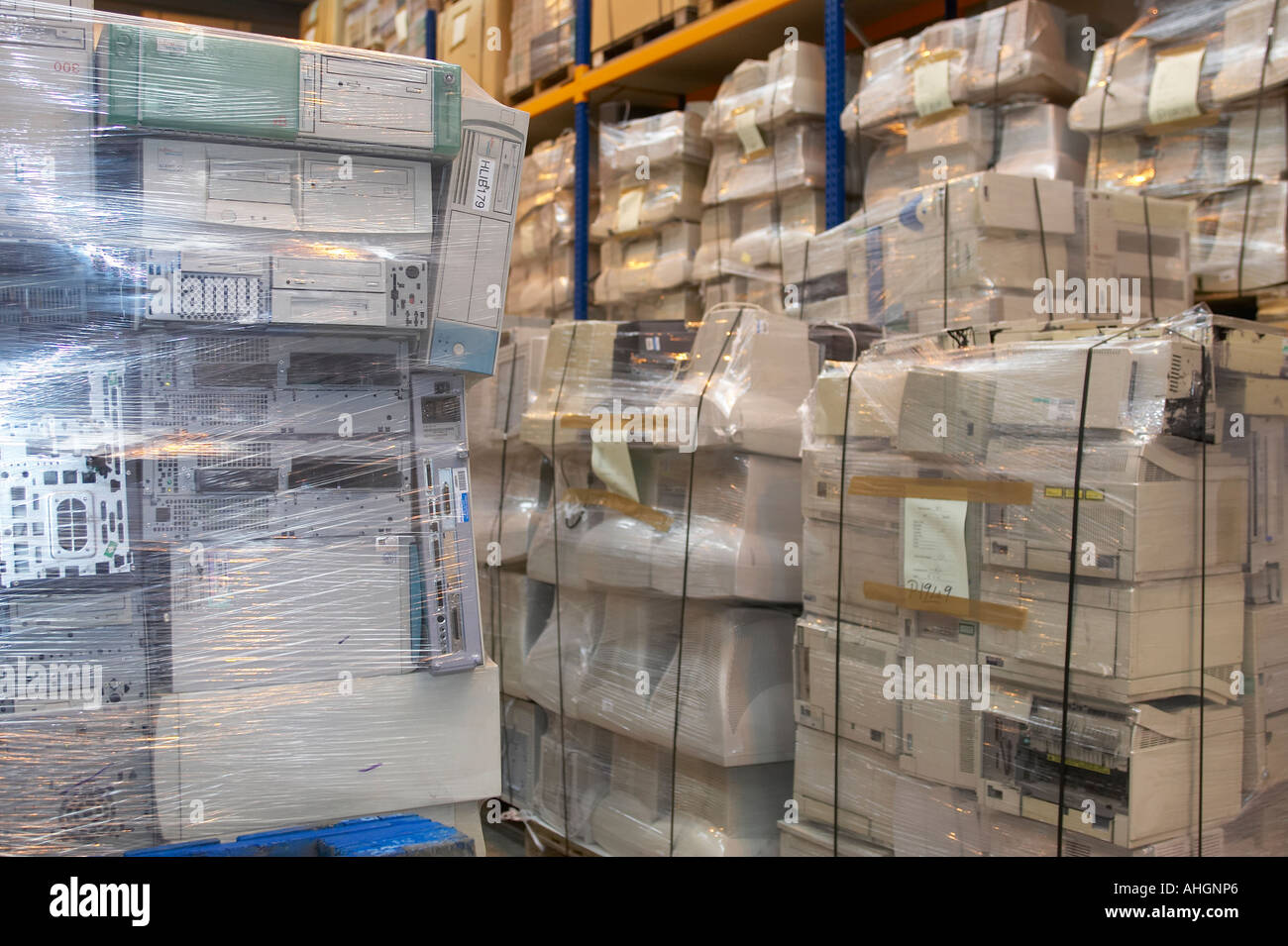 piles of pallet wrapped old discarded computer CRT monitorsand system ...