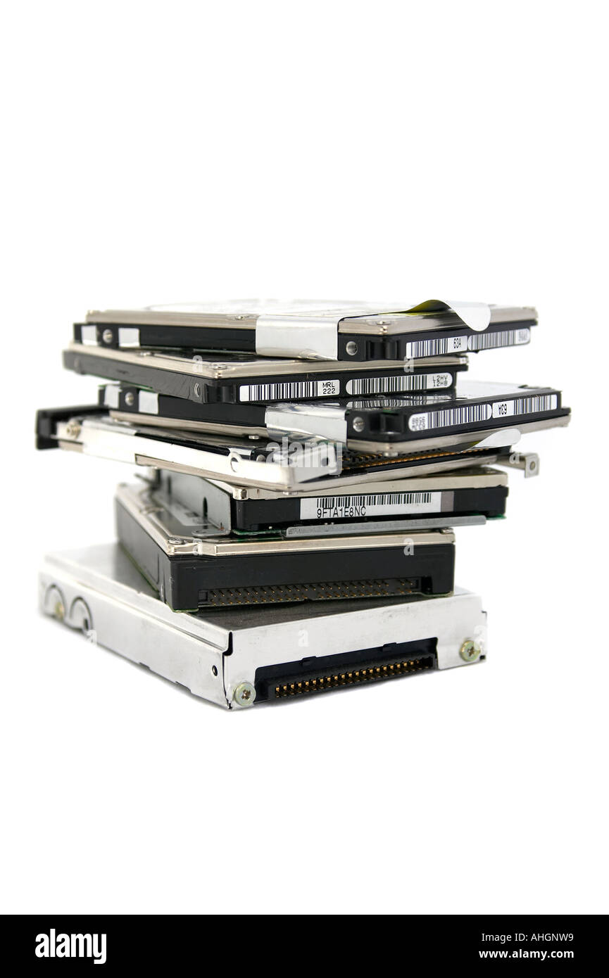 Pile of laptop hard discs against a white background Stock Photo - Alamy