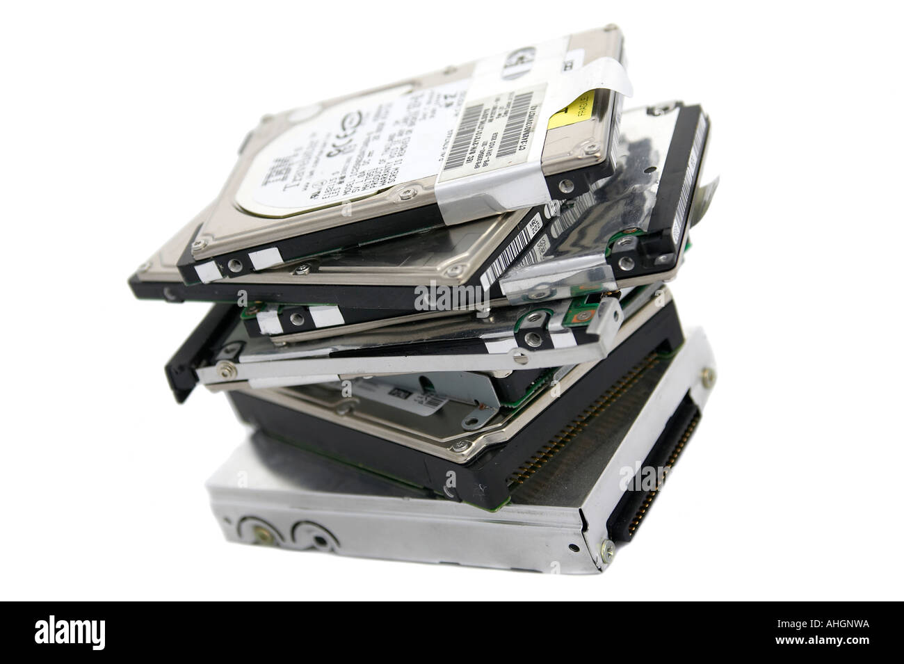 Pile of laptop hard discs against a white background Stock Photo - Alamy