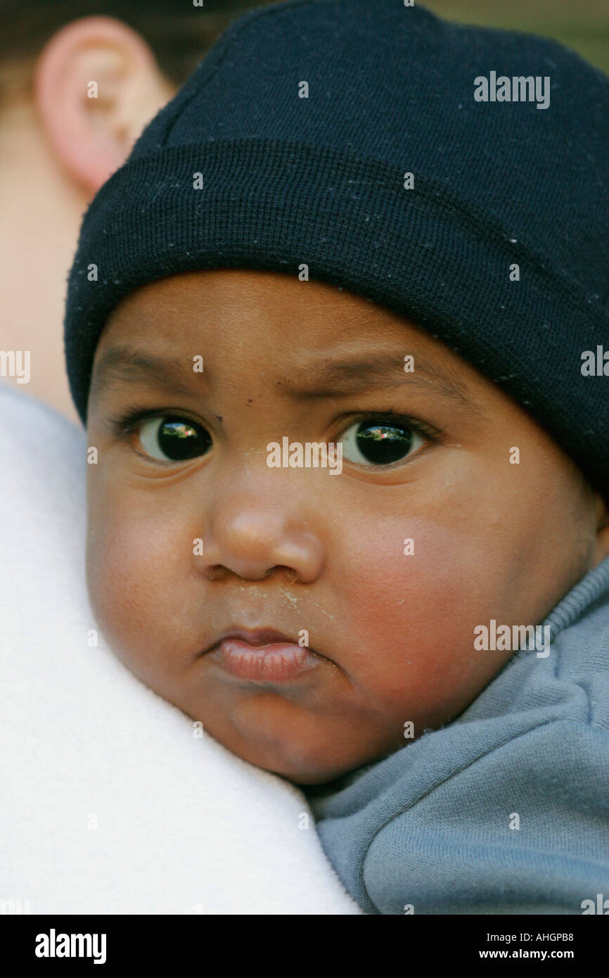 Close up portrait of young aboriginal boy in his mothers arms Stock ...