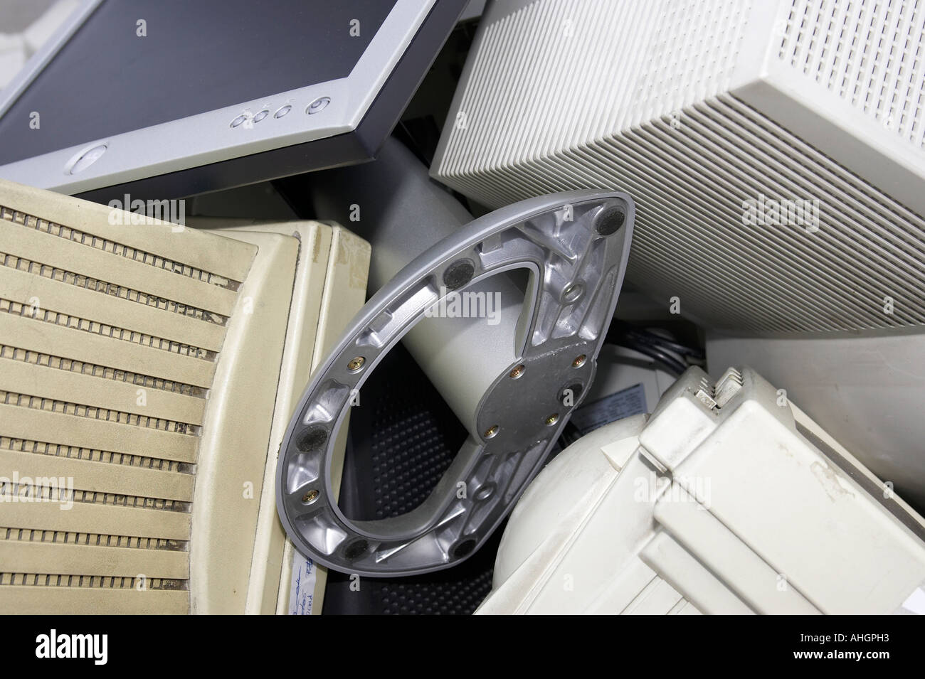 pile of old broken computer CRT and LCD TFT monitors and metal stand ...