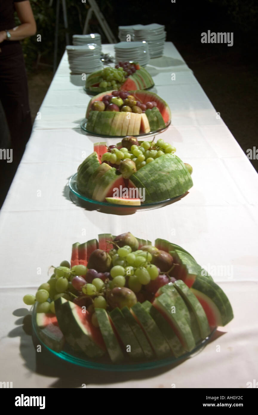 a table set with fruit and cakes buffet Stock Photo - Alamy
