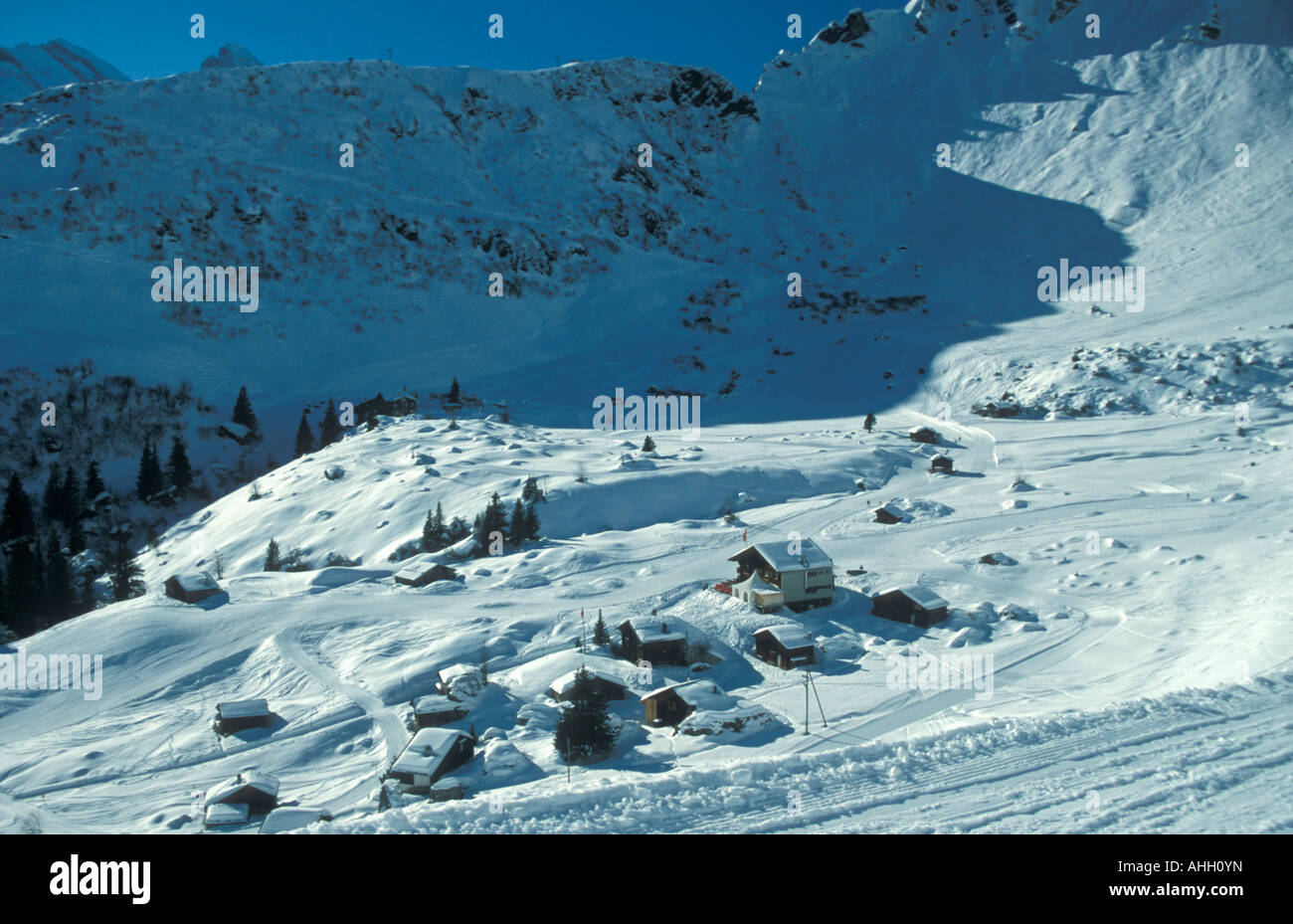Chalets and snow covered roads in the Wengen ski area of Switzerland ...