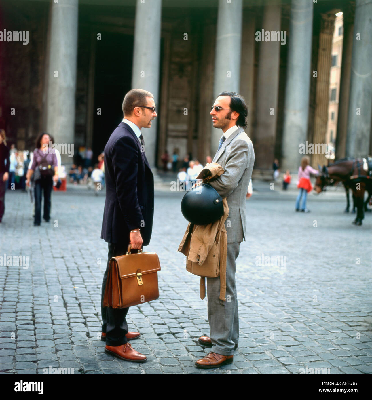 Two Southern European businessmen in conversation outside the Pantheon ...