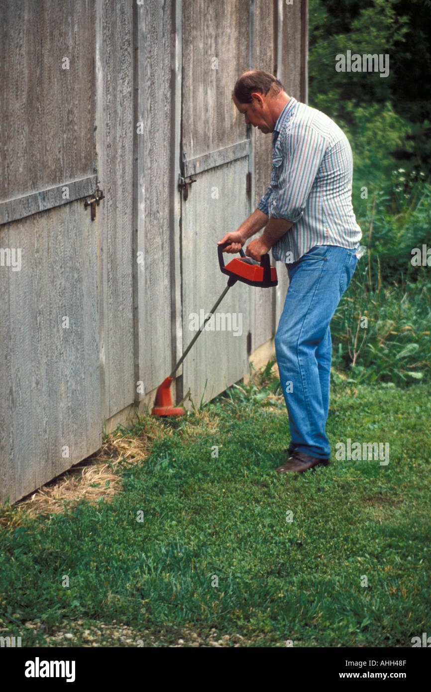 Trimming lawn edges hi-res stock photography and images - Alamy