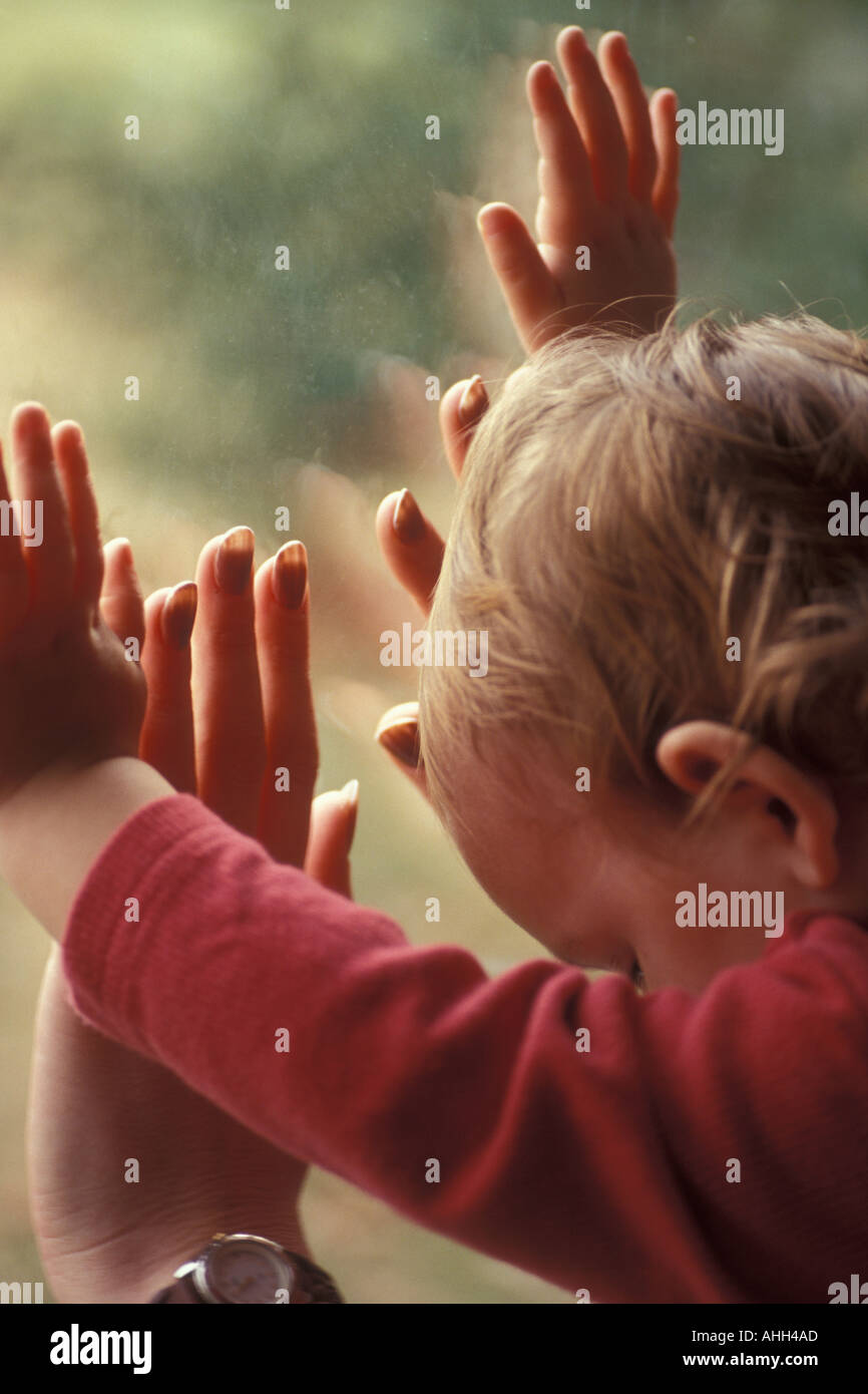 Hands against Glass Door Stock Photo - Alamy