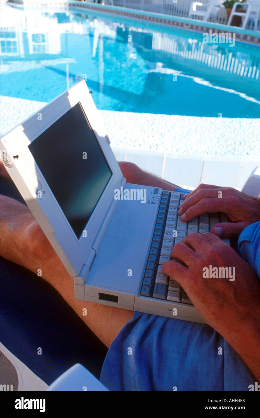 Laptop by Swimming Pool Stock Photo - Alamy