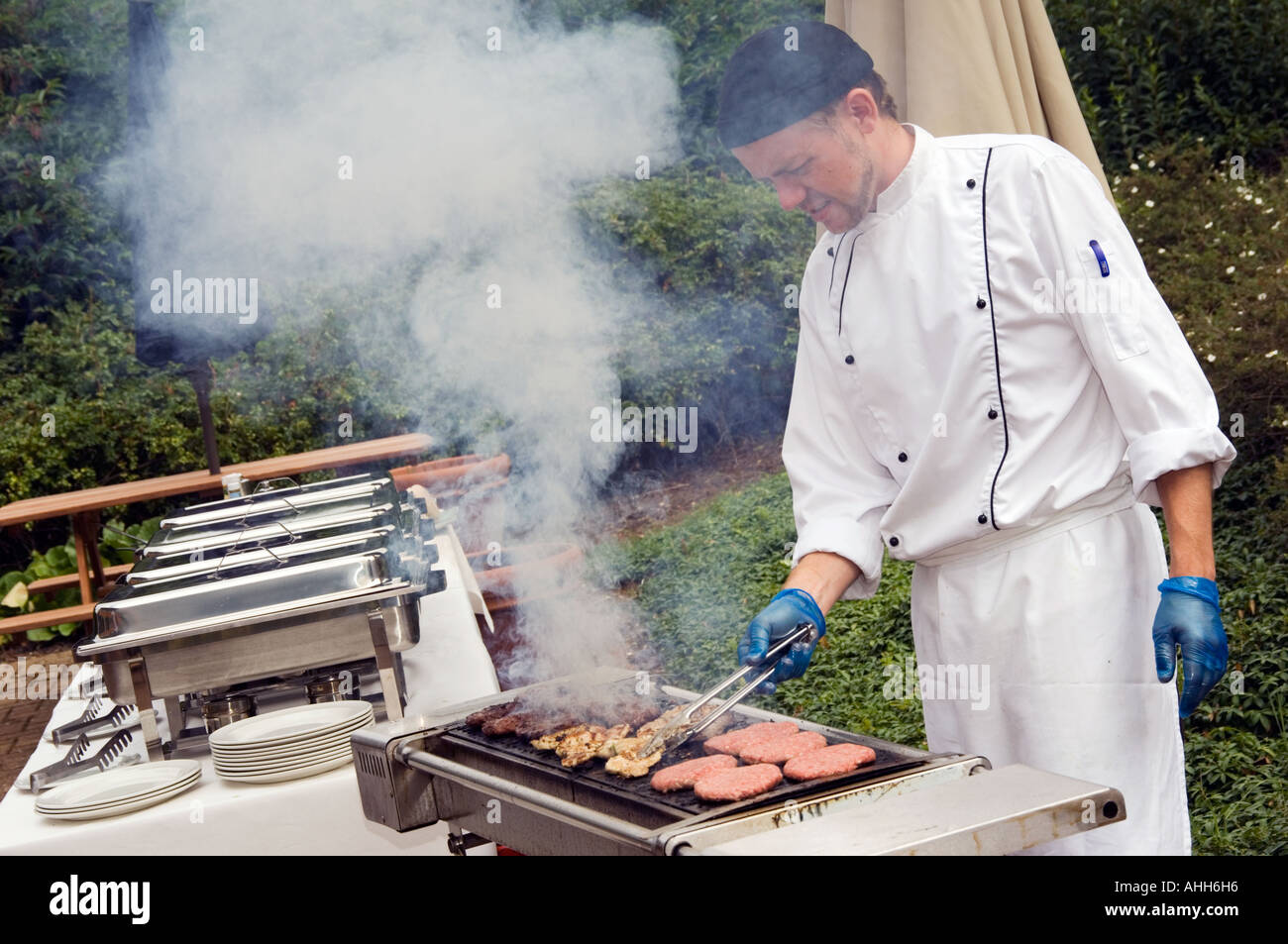 chef cooking on a barbecue Stock Photo - Alamy