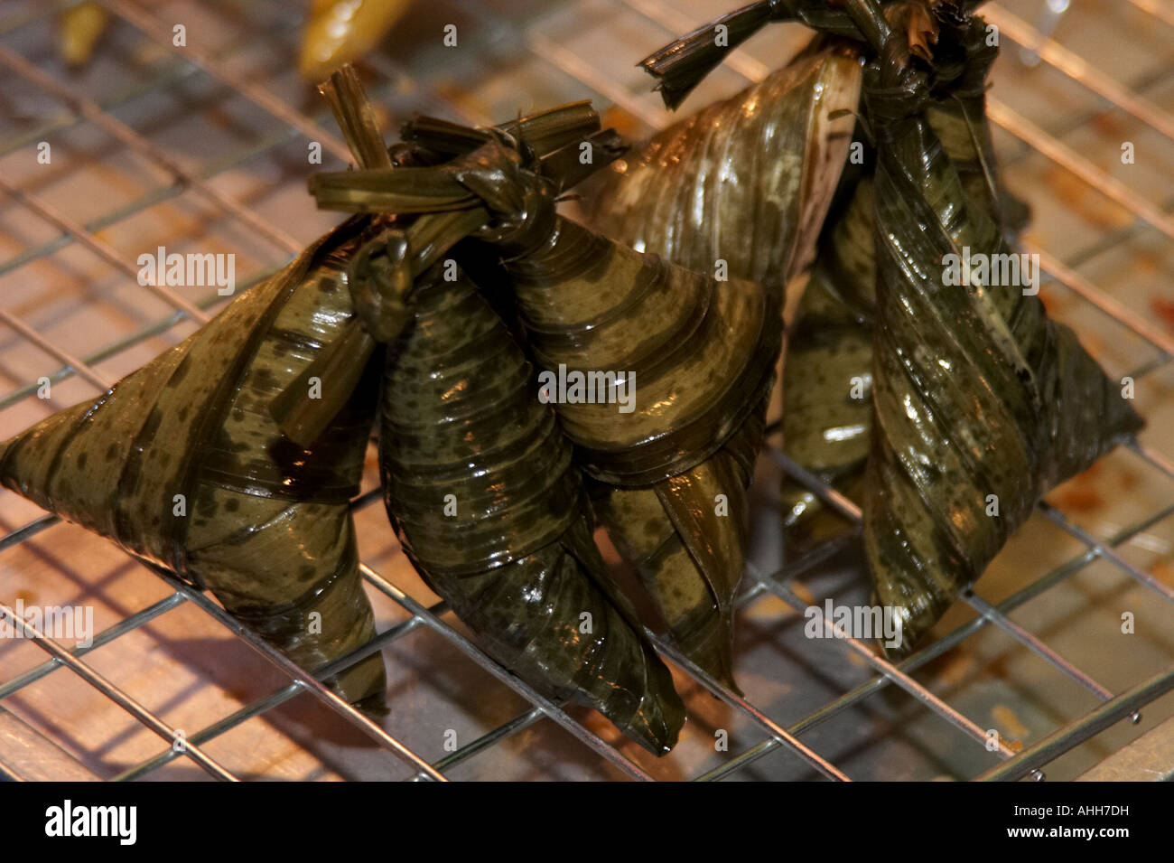 Steamed Rice dumpling wrapped in bamboo leaves, Zongzi Stock Photo - Alamy