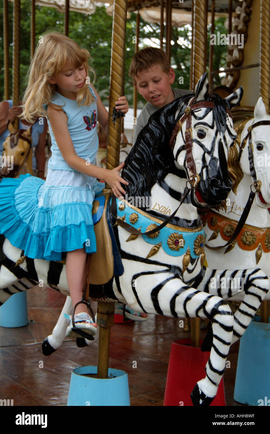 Children on funfair ride. England UK. Galloping horses Stock Photo - Alamy