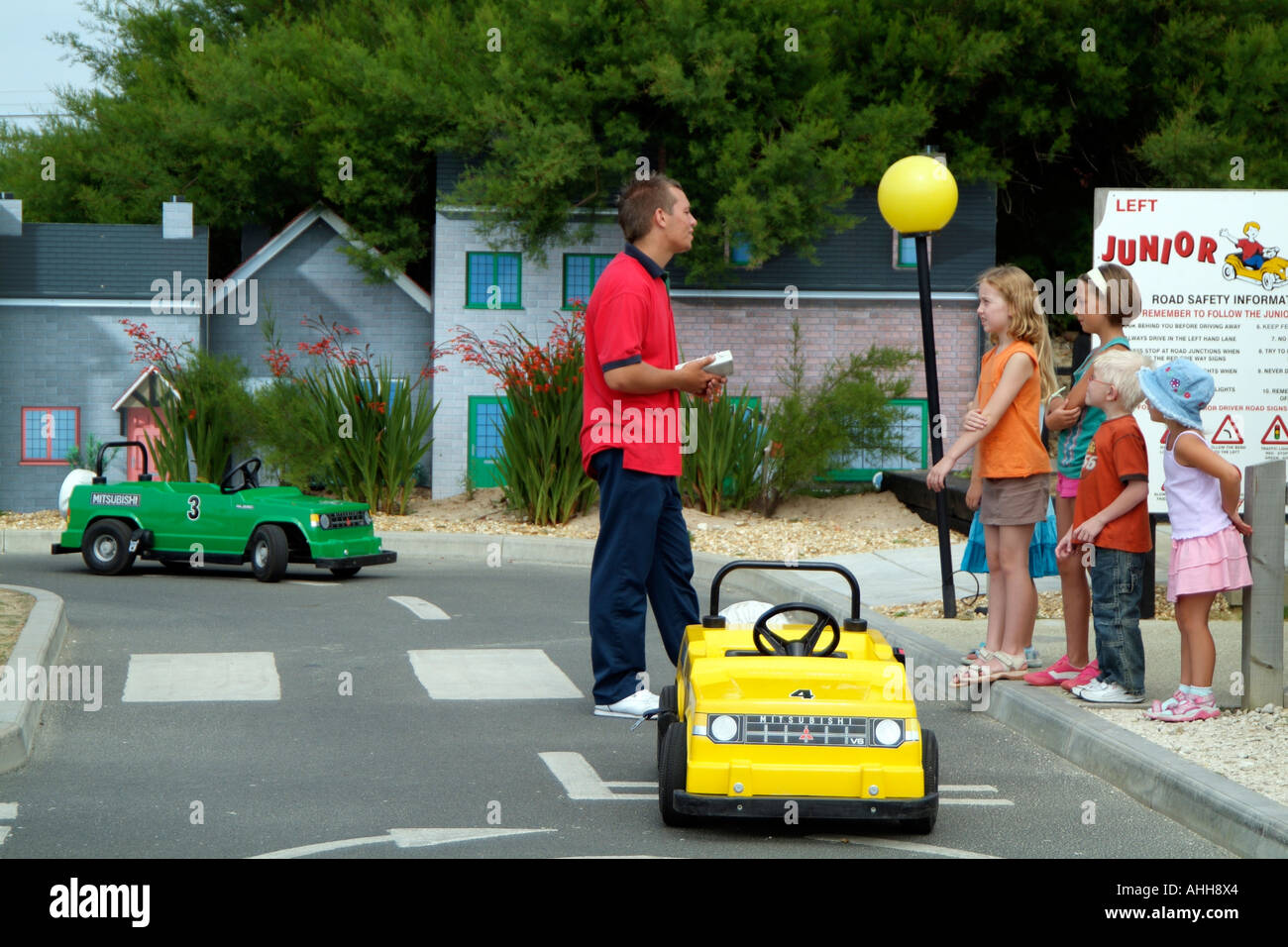 Driving lessons for children. Kids learning the rules of the road using ...