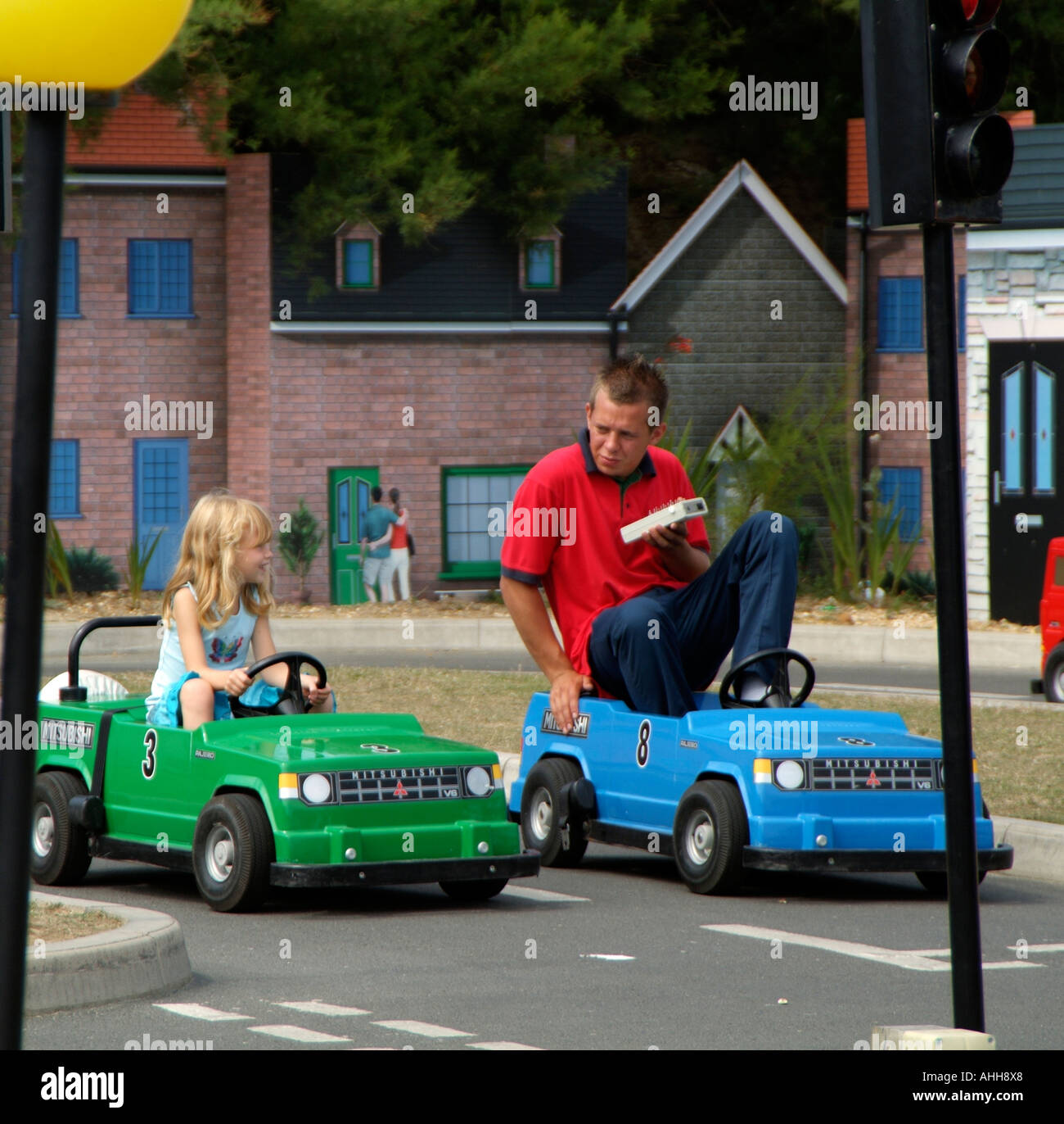 Driving lessons for children. Kids learning the rules of the road using ...