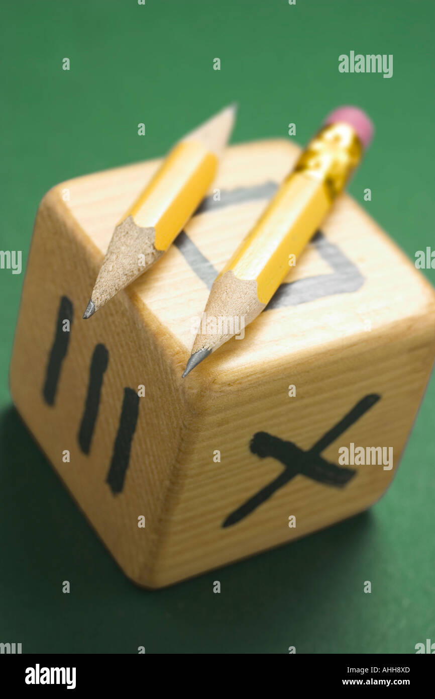 Short Pencils on Wooden Cube Stock Photo - Alamy