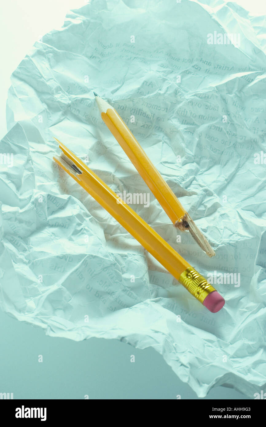 Snapped Pencils on Crumpled Paper Stock Photo - Alamy