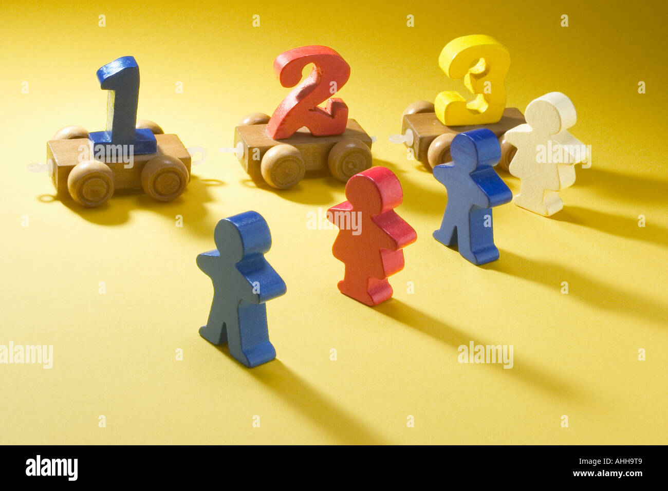 Wooden Children Figures with Numbers on Toy Cart Stock Photo - Alamy