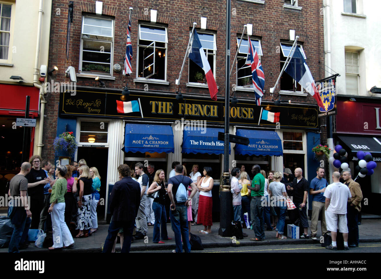 People drinking outside the French House pub in Soho London UK Stock ...