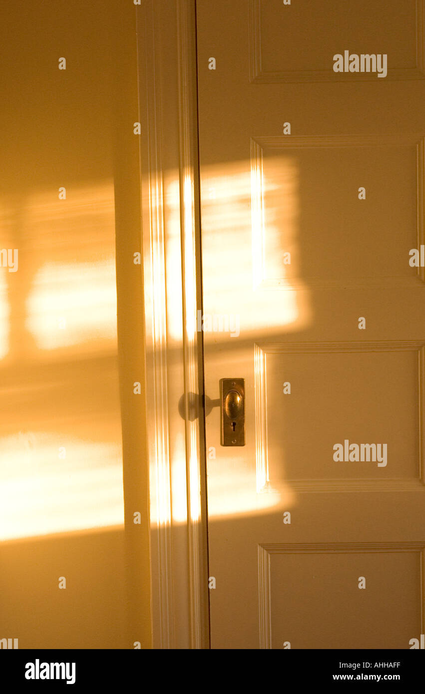 shadow and sunlight reflect on door and doorknob in house Stock Photo ...