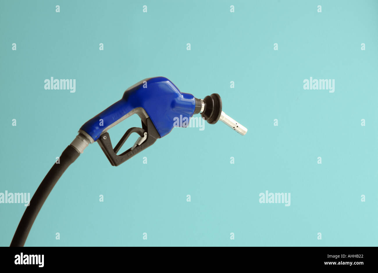 gas or petrol fuel pump on plain light blue backdrop Stock Photo - Alamy